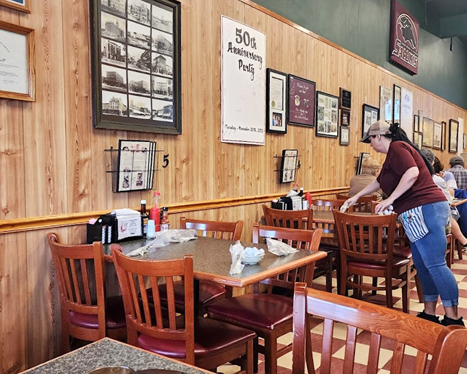 The dining area tells stories through its wood-paneled walls and framed memories. Every table has probably witnessed at least one "best breakfast ever" declaration.