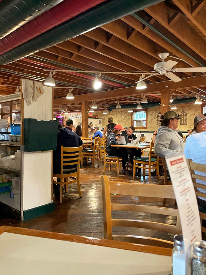 The dining room stretches back with simple tables and chairs, proving you don't need fancy decor when your food does all the talking.