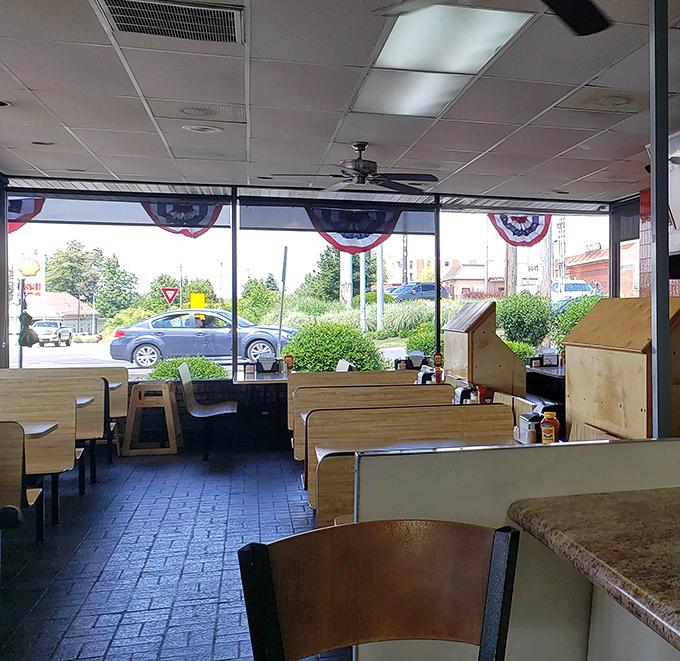 Large windows flood the dining area with natural light, making those wooden booths even more inviting. Breakfast with a view of Beckley.