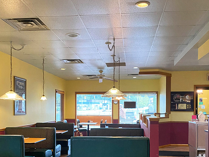 Pendant lights cast a warm glow over booths where countless coffee refills and life stories have been shared.