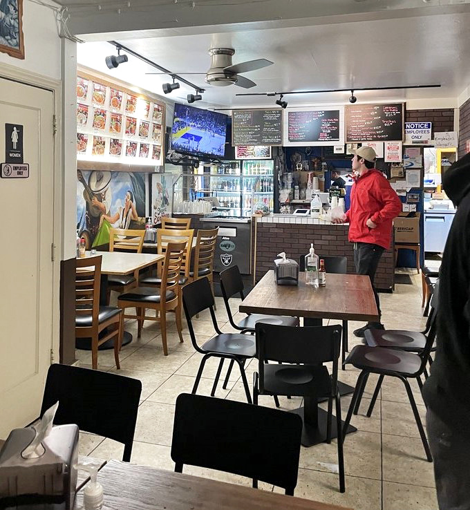 The modest dining area proves once again that the inverse relationship between decor budget and food quality is one of life's most reliable equations.