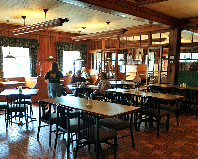 The dining room's brick floors and pine paneling create that timeless atmosphere where conversations flow as easily as the coffee.