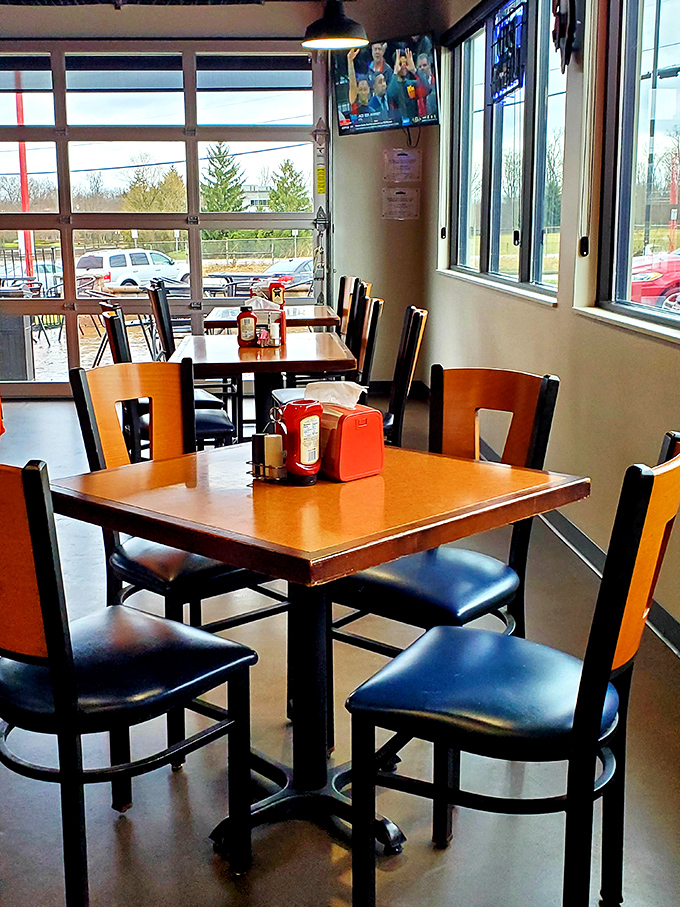 Natural light floods the dining area, illuminating tables where memories will be made and napkins will be sacrificed to the barbecue gods.