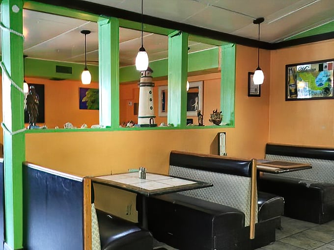 More vibrant dining space where the colorful decor matches the bold flavors coming out of that busy kitchen window.