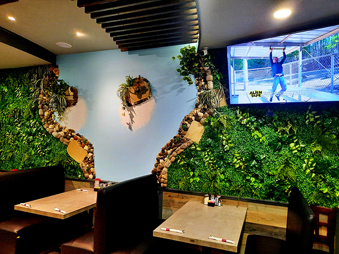 The living wall feature creates a surprisingly serene backdrop for your morning coffee ritual. Nature and nurture in one spot!
