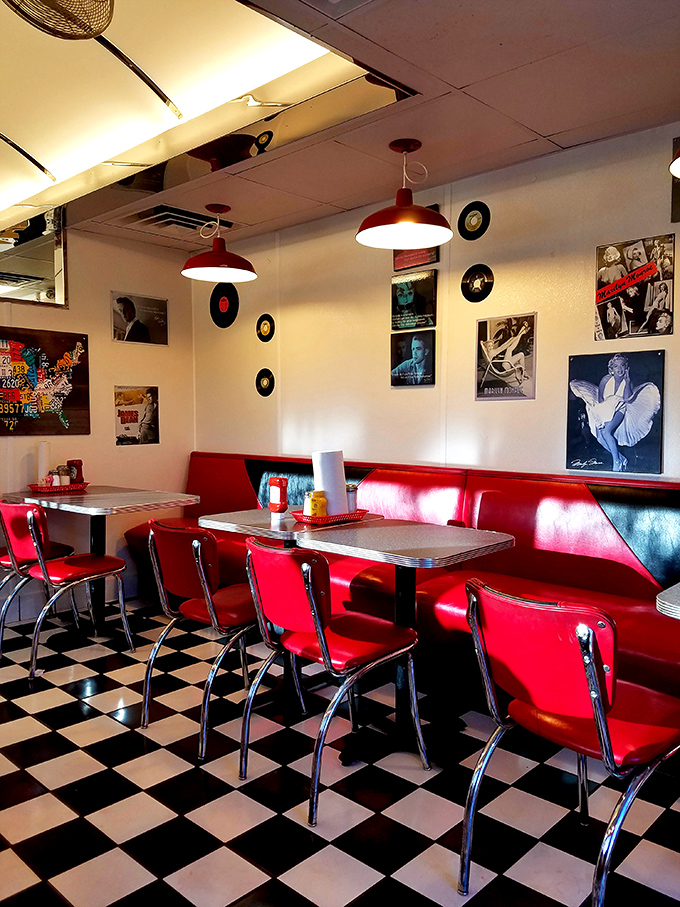 Red booths, chrome accents, and walls adorned with music legends &ndash; this isn't decoration, it's a full-immersion American diner experience.