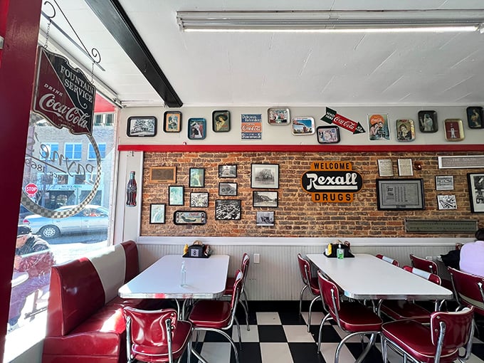 Red vinyl booths against exposed brick walls create the perfect backdrop for both family meals and the inevitable "remember when" Instagram posts.