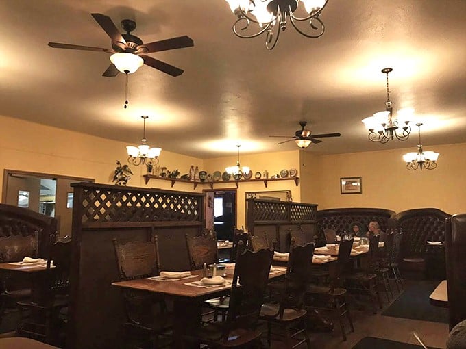 The warm glow of chandeliers transforms ordinary tables into stages where prime rib performances receive standing ovations nightly.