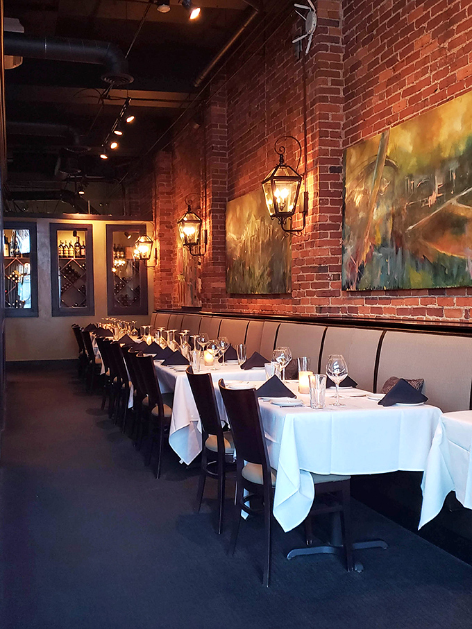 Exposed brick walls and white tablecloths create that perfect balance between rustic charm and sophisticated dining that Greenville does so well.