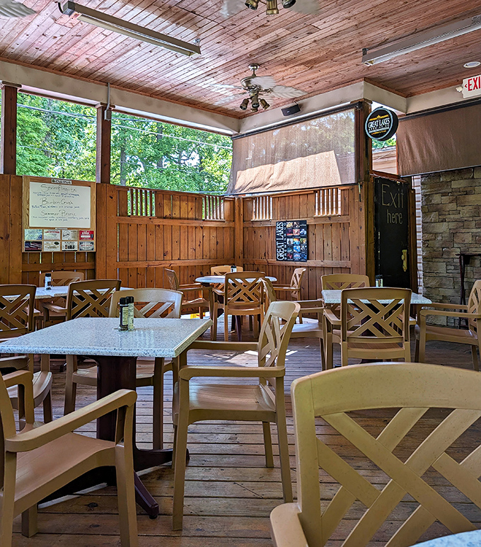 Another angle of comfort: wooden tables worn smooth by years of satisfied elbows, ready for your next food adventure.