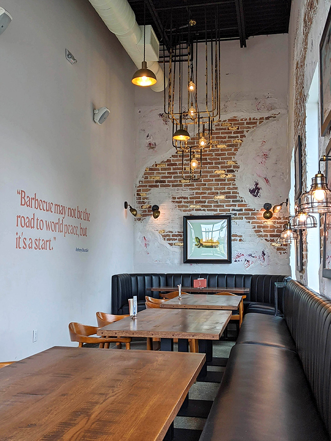 Exposed brick and thoughtful lighting create the perfect backdrop for serious eating. Barbecue philosophy included at no extra charge.