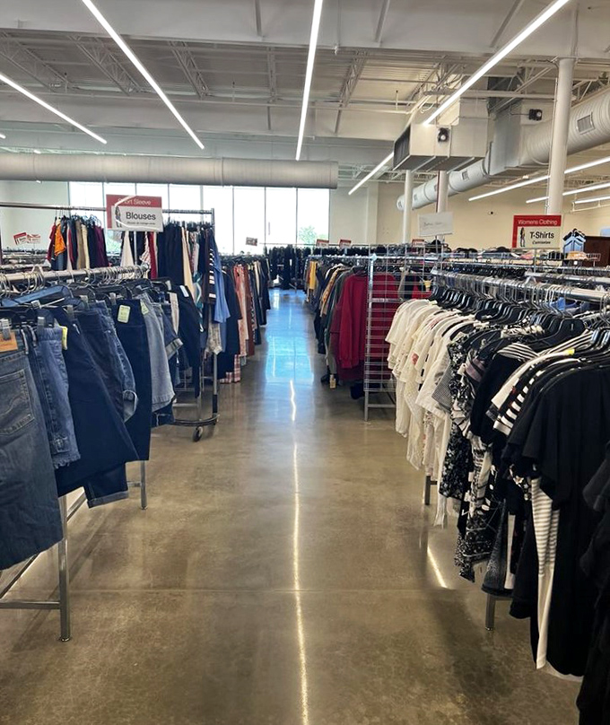 T-shirts and blouses arranged with care, not chaos. The color coordination here isn't just visually pleasing&mdash;it's a time-saving gift to shoppers with specific palettes in mind.