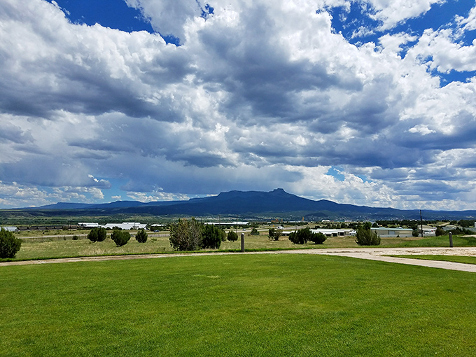 Under dramatic Colorado skies, Fisher's Peak stands sentinel over Trinidad's landscape like a natural fortress guarding this frontier town.