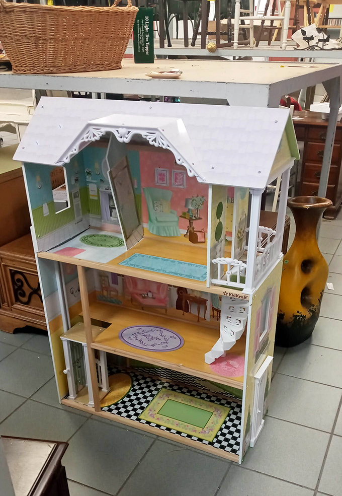 The children's section transforms into a wonderland where this dollhouse, priced less than dinner for two, awaits its next imaginative owner.