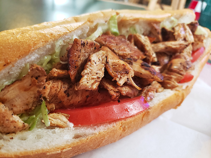 The sandwich that demands two hands and zero shame—packed with seasoned meat and fresh veggies, it's a handheld feast.