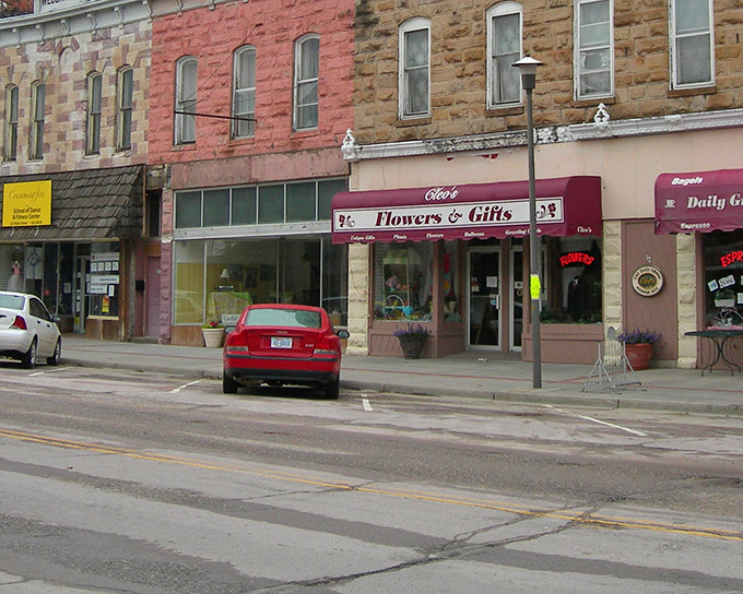 The flower shop's cheerful awning adds a pop of color to the streetscape, like nature's exclamation point on Main Street.