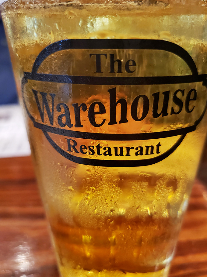 A frosty beer bearing The Warehouse logo &ndash; because sometimes the perfect beverage is the one that lets the food be the star.