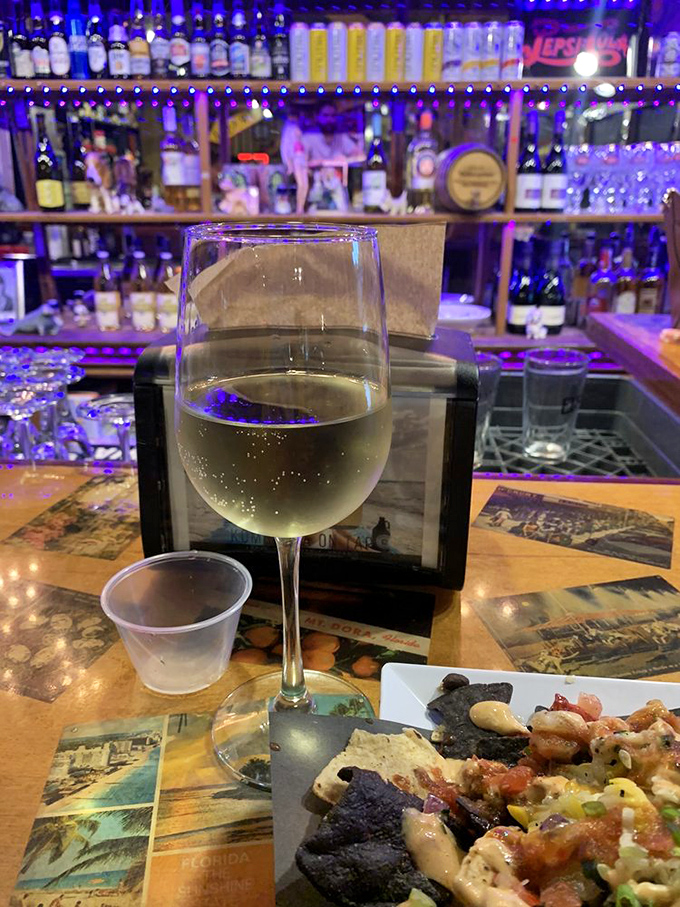 The bar's purple glow isn't just mood lighting&mdash;it's a beacon calling you toward liquid refreshment after a sauce-laden feast.