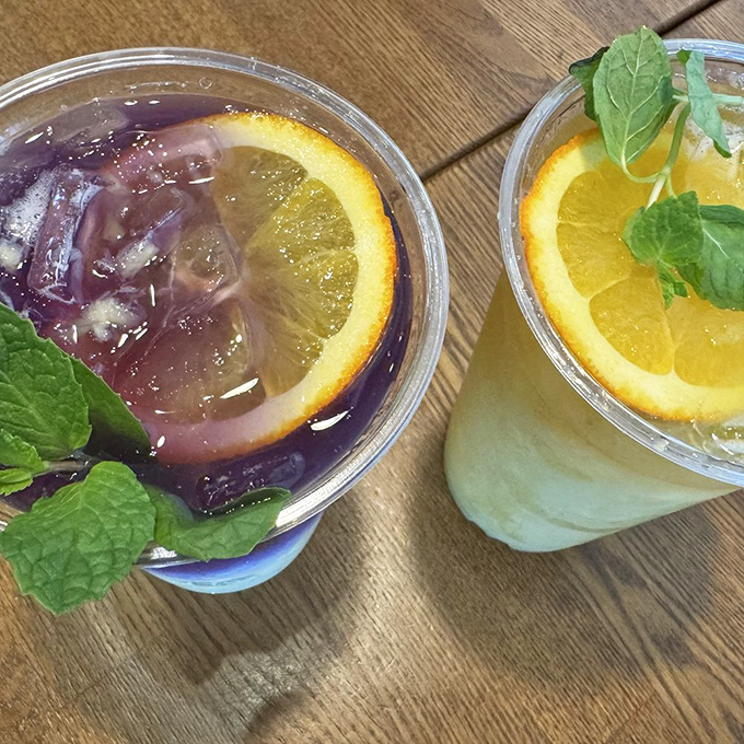 Refreshing fruit teas garnished with fresh mint and orange slices&mdash;the perfect counterpoint to the savory feast you've just demolished.