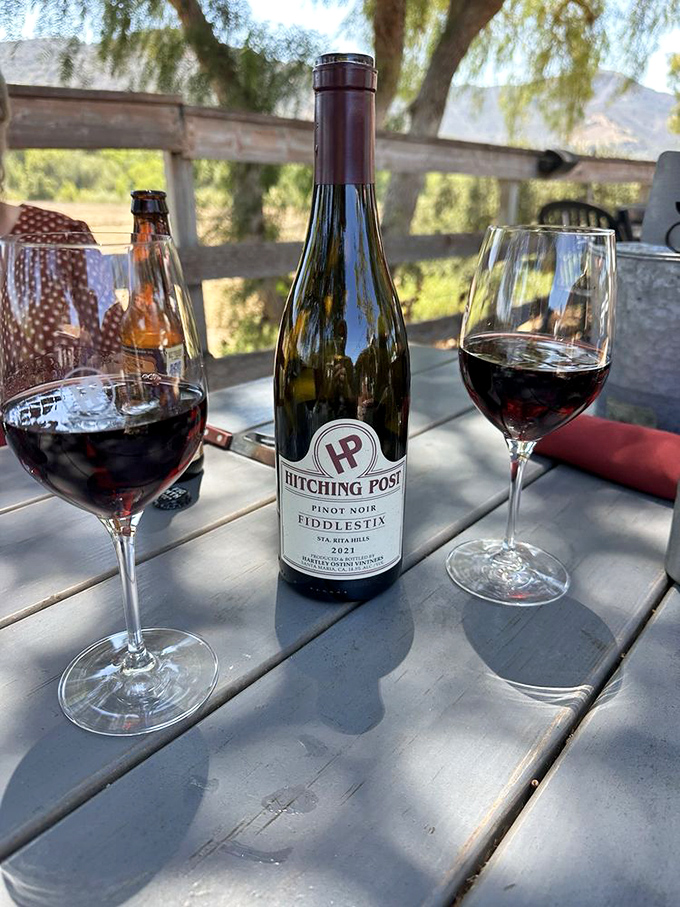 The Hitching Post's own Pinot Noir against the backdrop of Santa Ynez Valley – wine country doesn't get more authentic than this.
