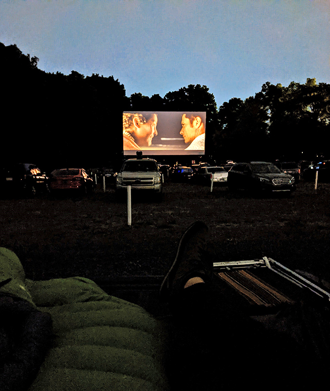 As darkness falls, the movie comes alive on screen. That magical moment when the world shrinks to just you and the story.