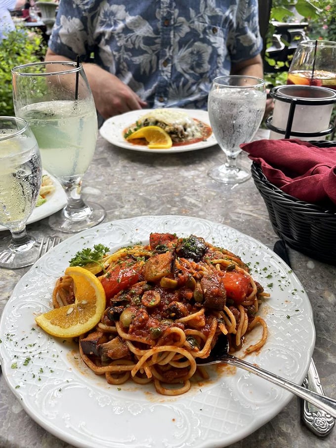 A pasta dish that's having more fun than most people on vacation, loaded with vegetables and swimming in a sauce worth writing home about.