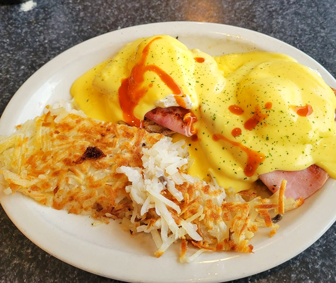 Eggs Benedict with a drizzle of hot sauce&mdash;because sometimes perfection needs just a little kick in the pants to keep things interesting.