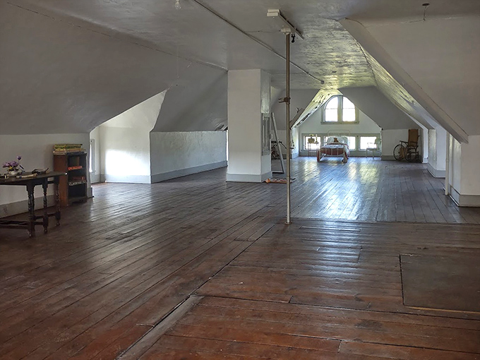 Sunlight streams through attic windows, illuminating wide-planked floors where footsteps &ndash; both visible and invisible &ndash; have tread for generations.