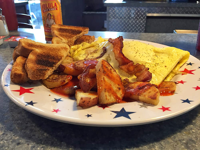Breakfast of champions! This farmers omelet with perfectly crispy home fries and buttery toast isn't just a meal&mdash;it's morning poetry on a star-spangled plate.