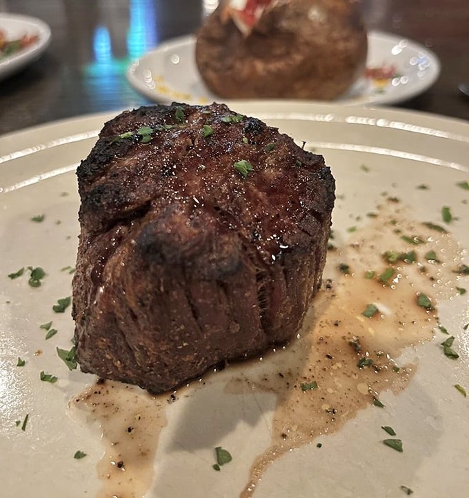 This filet mignon, sporting a sear that belongs in the Steak Hall of Fame, sits in a pool of silky sauce.
