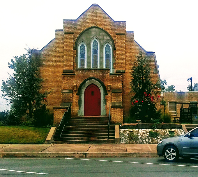 First Christian Church's striking red door seems to say, "Come in, we've been expecting you," with architectural eloquence.