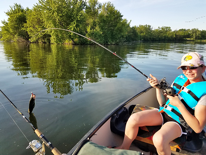 Catching dinner while making memories&mdash;the Lake View double special. That smile says either "I'm having the time of my life" or "I can't believe I remembered the worms this time."
