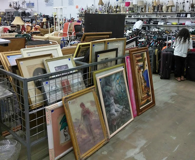 Art in limbo&mdash;frames within frames creating a gallery of forgotten masterpieces and prints that once defined someone's living room aesthetic.