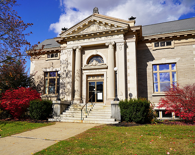 The Franklin Public Library's classical columns welcome knowledge-seekers of all ages. Free entertainment between these walls since the days of card catalogs.