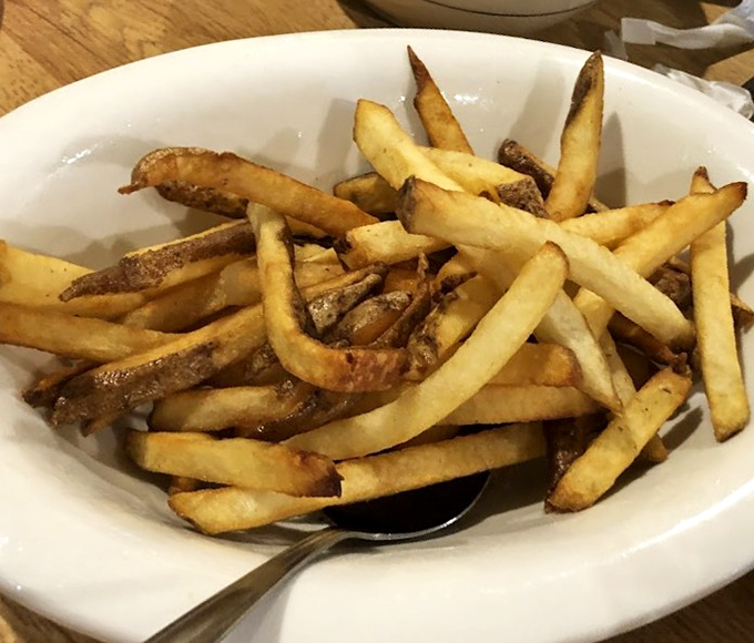 French fries cut by actual humans&mdash;what a concept!&mdash;crispy outside, fluffy inside, perfect every time.