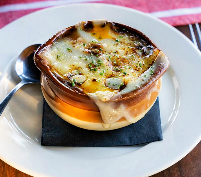 French onion soup that's wearing a golden crown of bubbling cheese&mdash;royalty in a crock that's worth the inevitable chin dab.