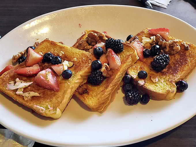 French toast that doesn't need a passport to impress, topped with berries that look like they were picked moments ago. Breakfast or dessert? Yes.