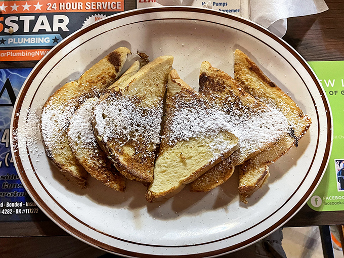 French toast dusted with powdered sugar&mdash;simple perfection that reminds you sometimes the classics don't need reinventing, just respect and good execution.