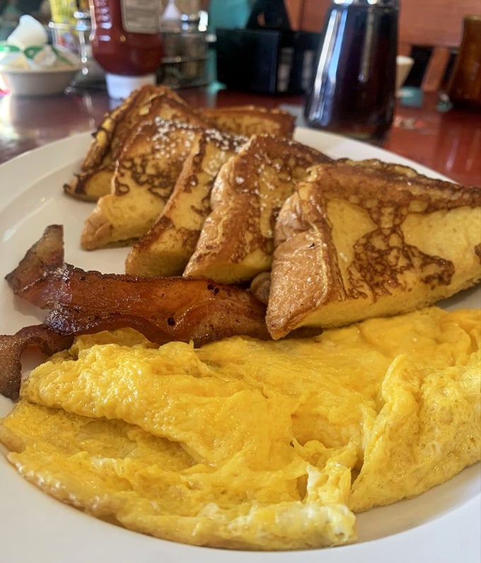 French toast that's achieved the perfect golden-brown tan, accompanied by bacon that's exactly how bacon should be&mdash;present.