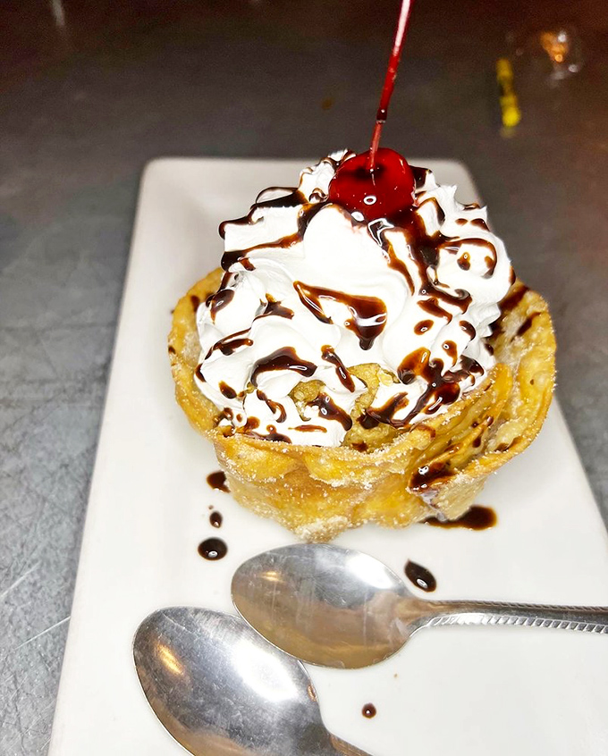 This towering dessert isn't just fried ice cream&mdash;it's a carnival of textures topped with whipped cream and chocolate drizzle.