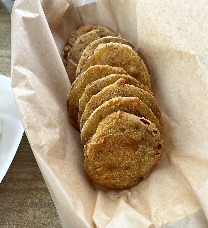 Fried green tomatoes stacked like golden coins &ndash; a Southern currency that's always accepted at the table of good taste.