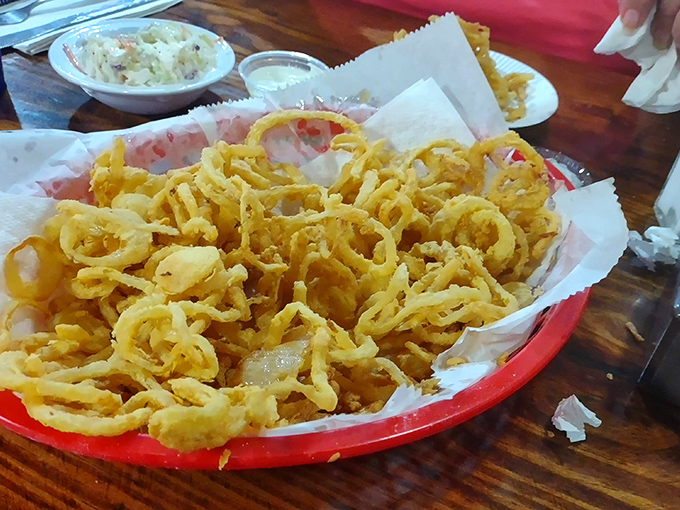 More onion rings because apparently one basket isn't enough – and honestly, who's arguing with that logic?
