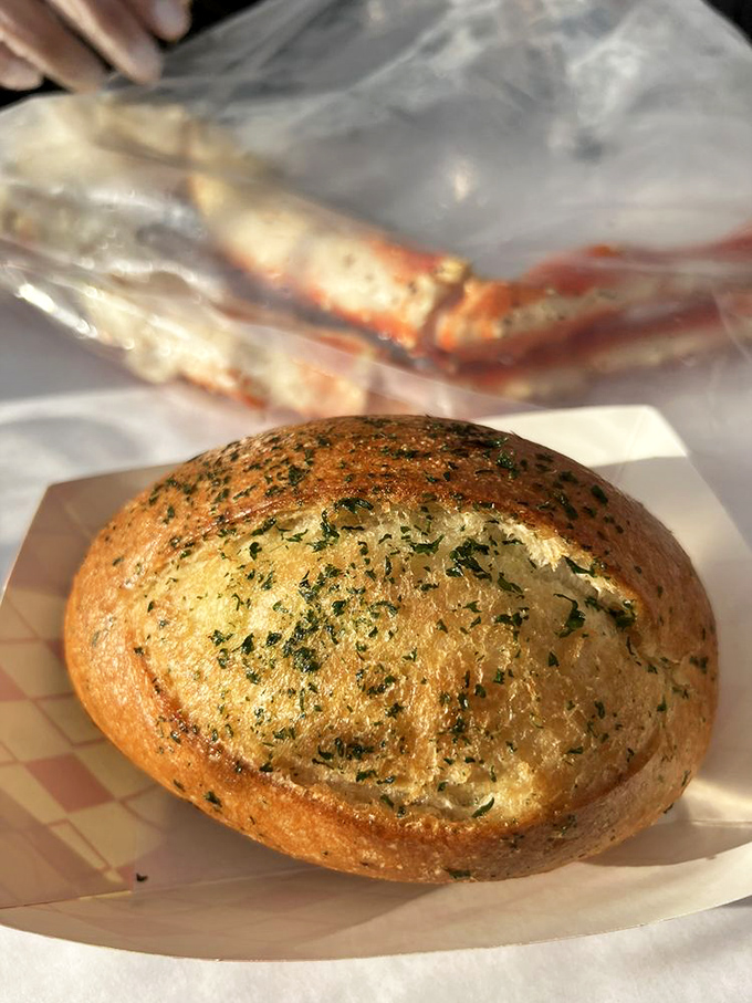 This herb-flecked garlic bread isn't just a side &ndash; it's the essential tool for soaking up every last drop of that precious seafood sauce.