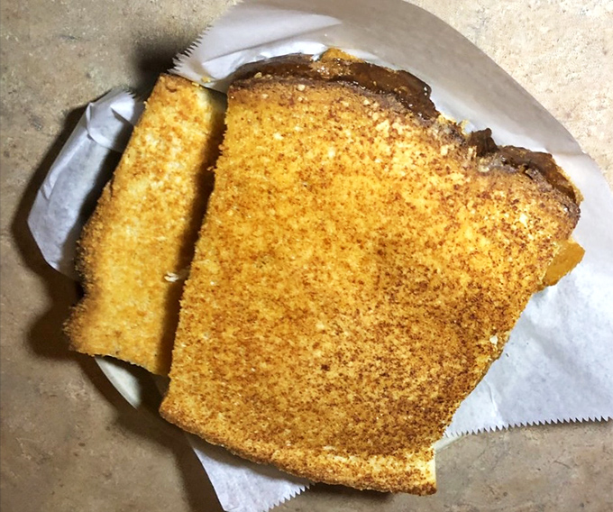 Garlic toast that's achieved the perfect golden hue—crisp enough to hold up to sauce, yet soft enough to remind you of simpler, happier times.