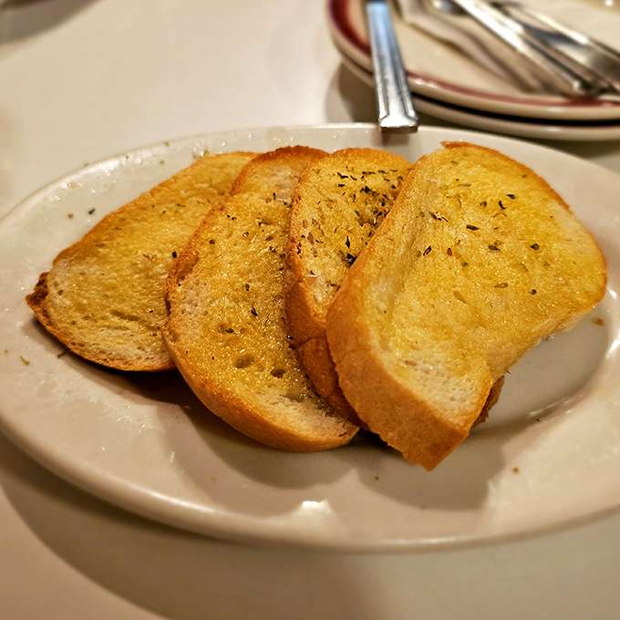 Garlic bread done right &ndash; crisp edges, buttery middle, and just enough garlic to keep vampires away but not your dining companions.