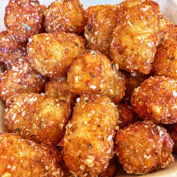 These aren't your average tots&mdash;they're garlic parmesan potato bombs that somehow manage to be both crispy and fluffy, like edible magic tricks.