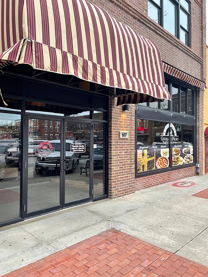 George & Nick's striped awning signals the universal truth that pizza and steaks taste better when you're not worrying about next month's bills.