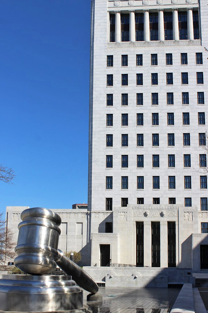 Blue skies and jurisprudence! The massive metallic gavel stands in perfect contrast to the stately Ohio Supreme Court building, like a superhero's prop outside their secret headquarters.