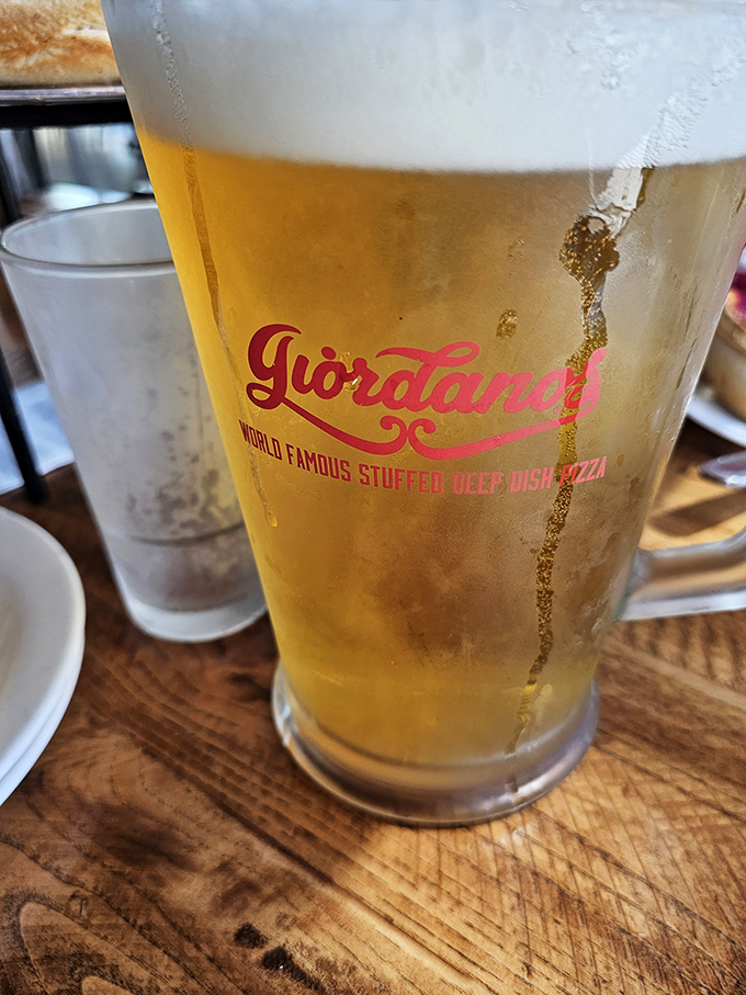 A frosty beer in Giordano's branded glass &ndash; because pizza without beer is like Vegas without the lights. A perfect partnership.
