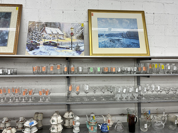 Glassware and artwork that tells stories of dinner parties past. That Thomas Kinkade-esque cottage scene has witnessed many toasts in its day.